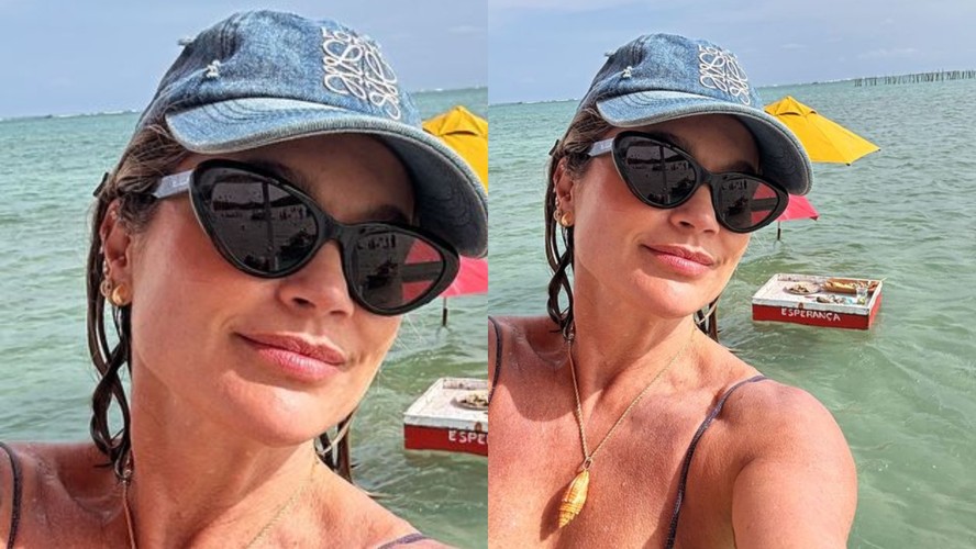 De biquíni, Flávia Alessandra toma banho de mar e exibe visual bronzeado